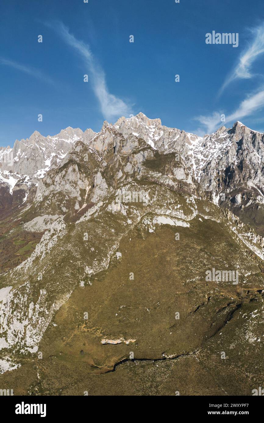 Majestic rugged peaks of the Picos de Europa National Park bask under a ...