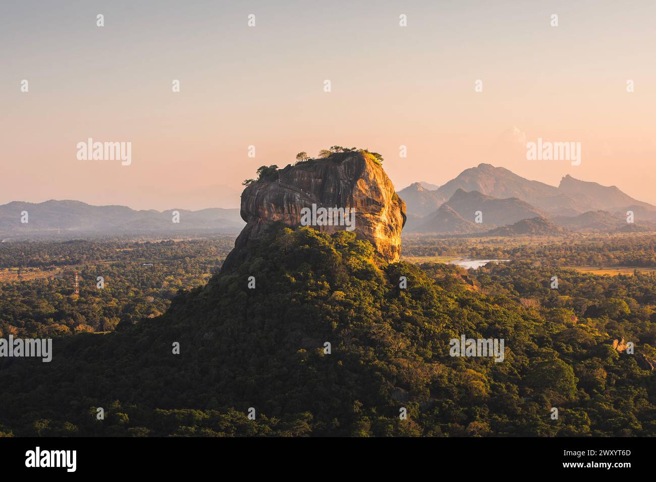Sigiriya rock also known as Lion Rock at golden light of sunset ...