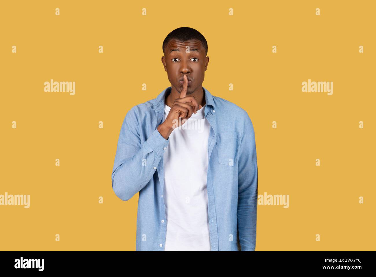 Man finger lips shushing on hi-res stock photography and images - Alamy