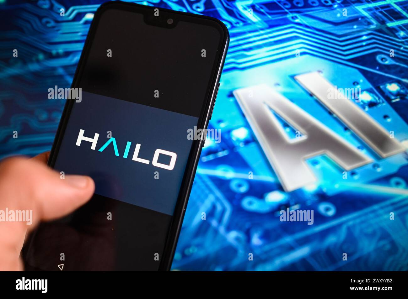 In this photo illustration a Hailo logo is displayed on a smartphone with Artificial ...