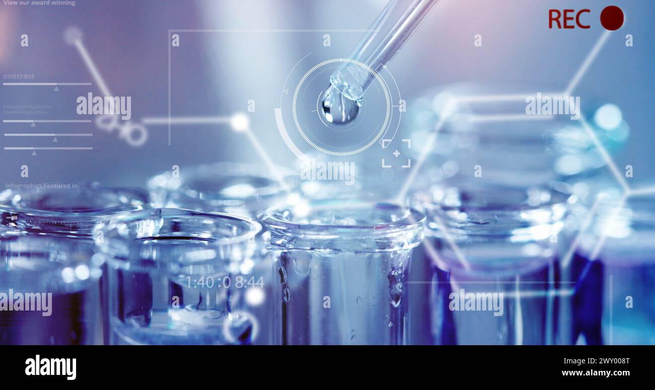 A detailed shot capturing a pipette dispensing a small drop of purple ...