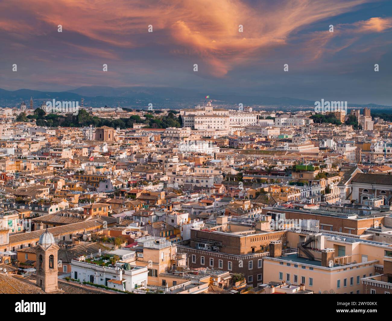 An aerial view of Rome at dusk reveals a sky changing from pink to blue ...
