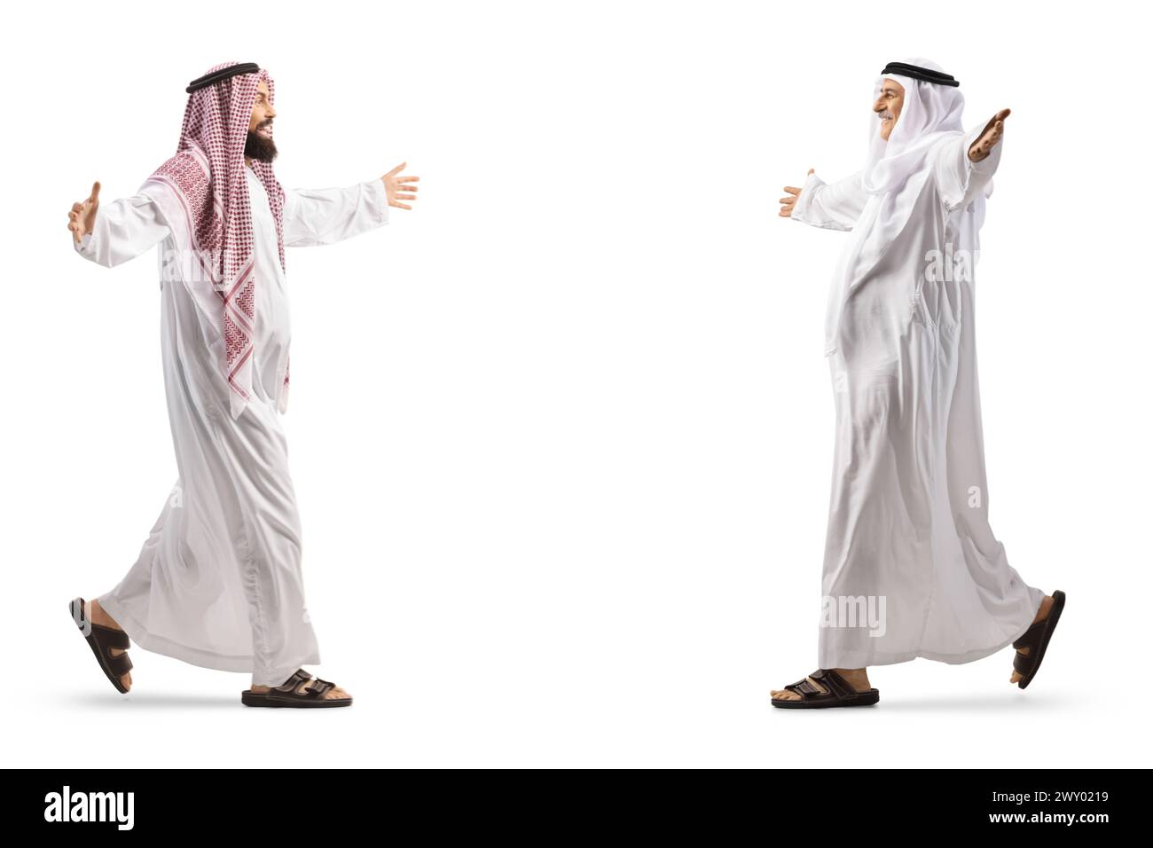 Full length profile shot of two men in a traditional robes walking and ...