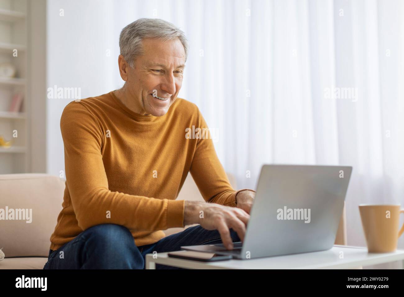 Old man happily sitting hi-res stock photography and images - Alamy