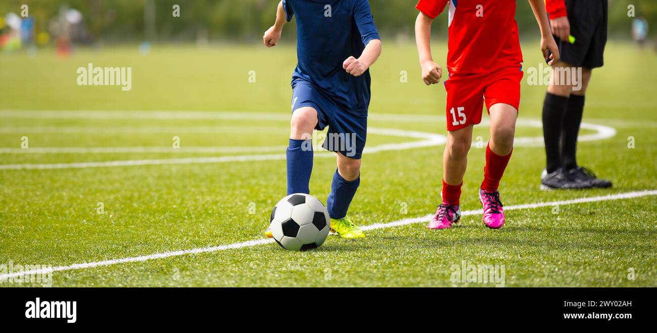Two Soccer Players Running Along Sideline During League Match. Youth ...