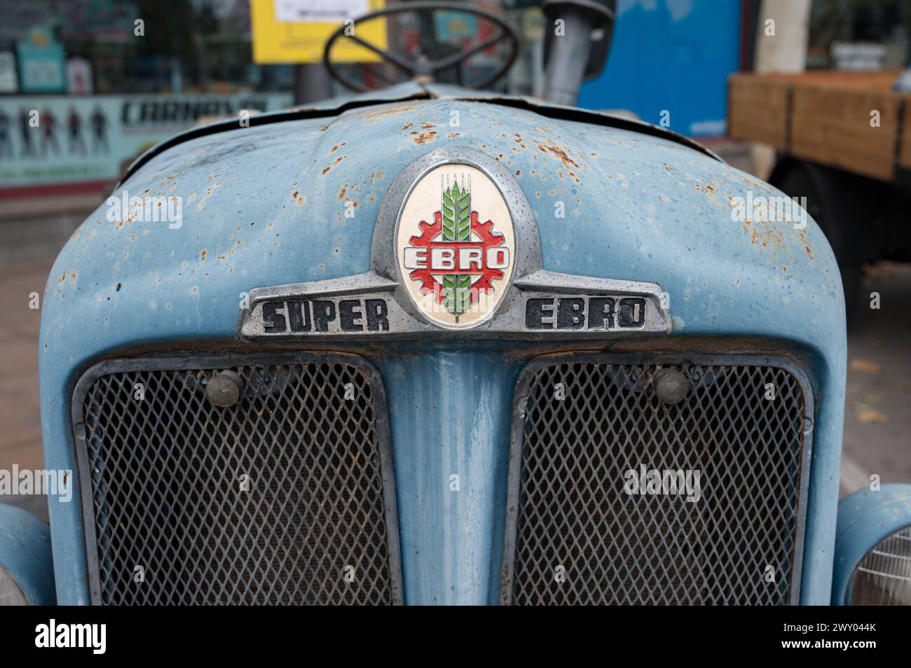 Detail closeup of the emblem of the brand of old blue Spanish tractor ...