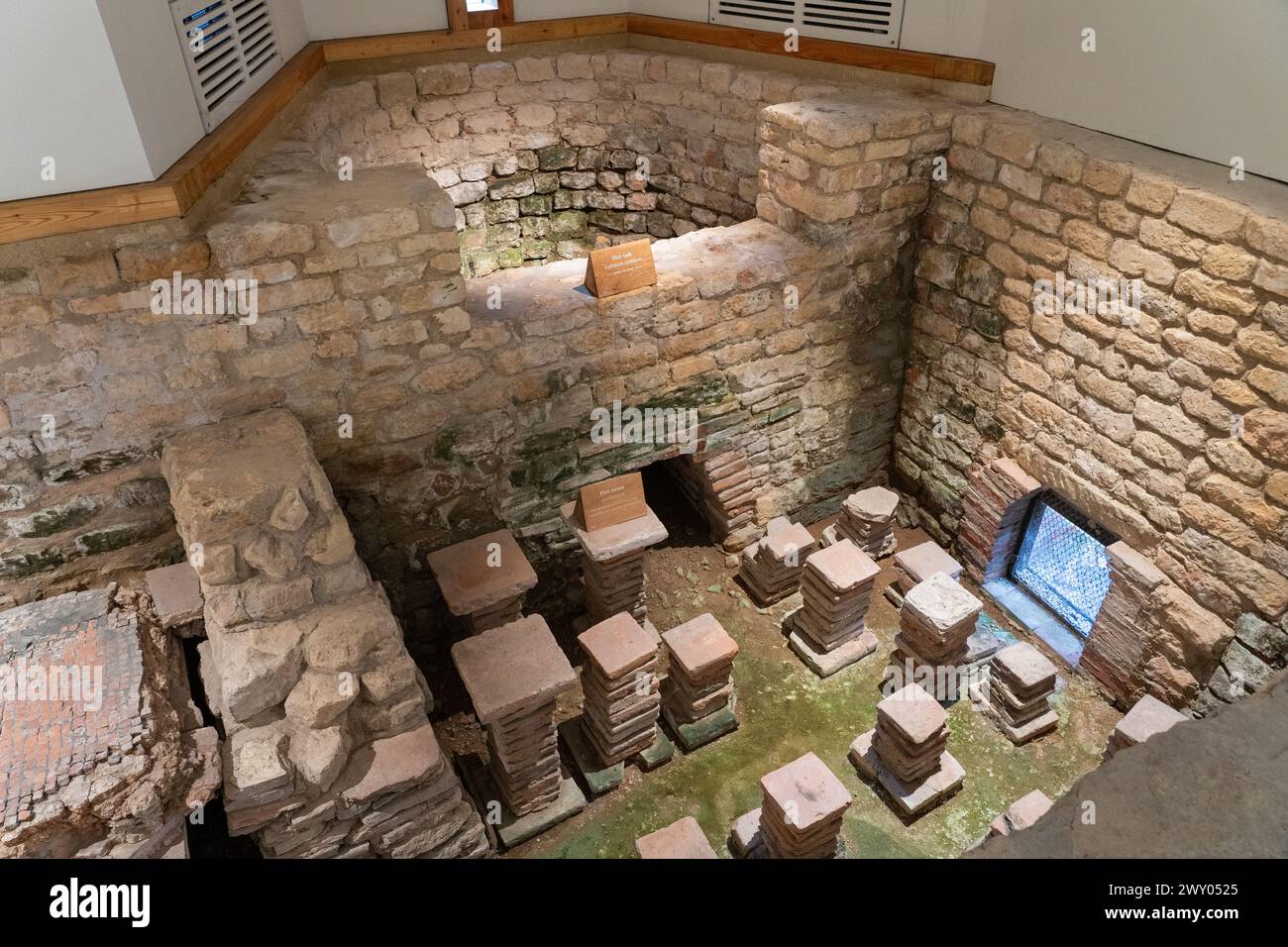 The hot room (calidarium) with underfloor hypocaust heating and hot tub (balneum calidum) in the ...