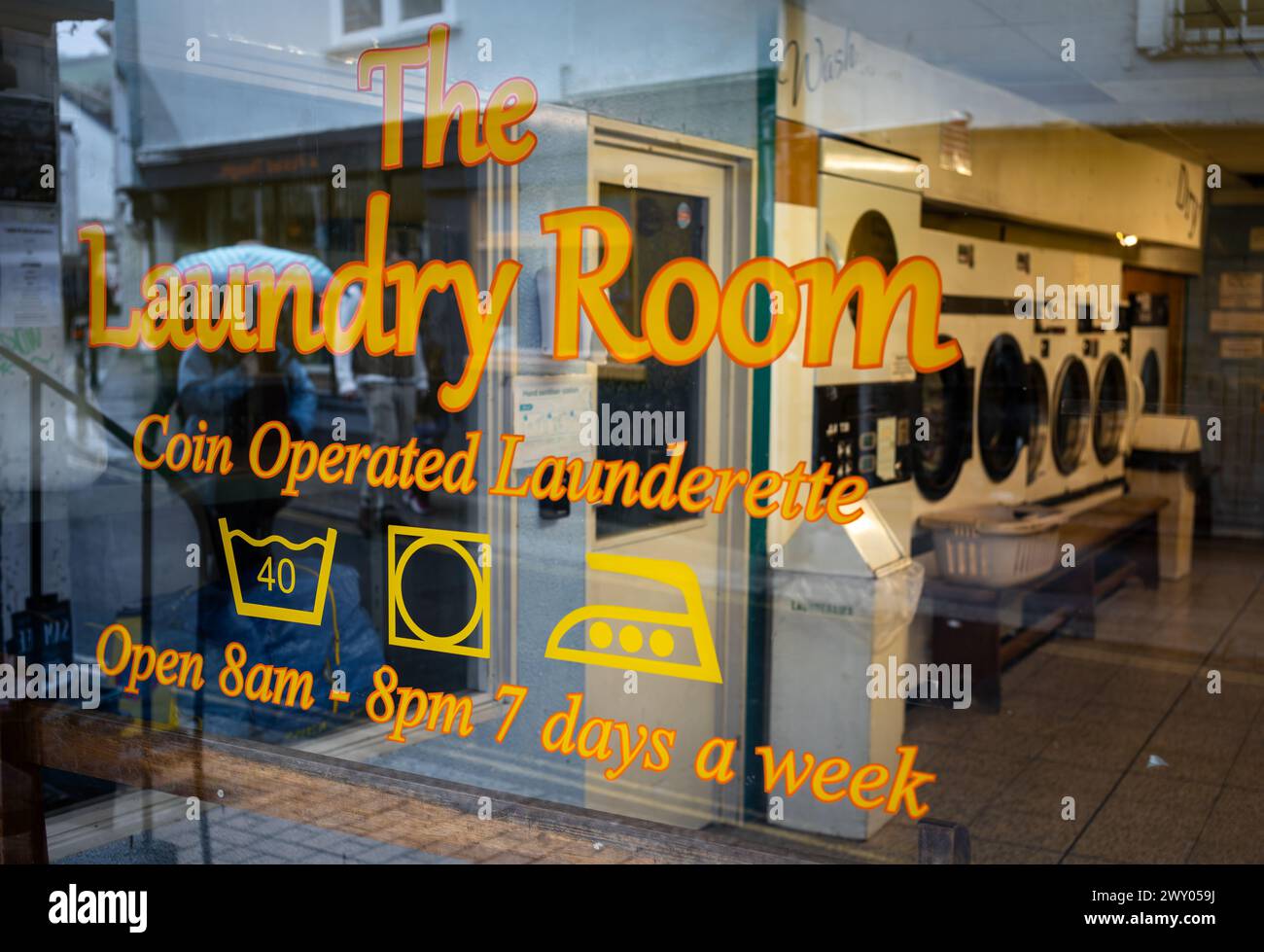 Looking through the window in to The Laundry Room, a coin operated ...