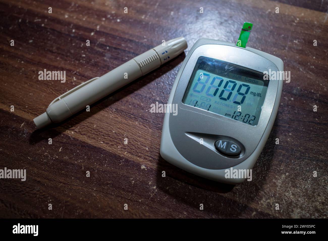 A glucometer and a lancet pen, blood glucose test, measuring glucose ...