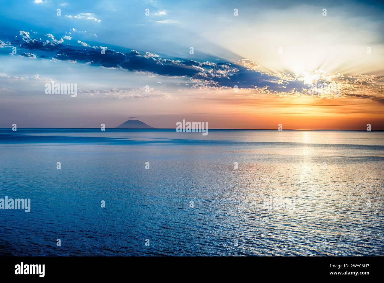 Scenic sunset with view of the Stromboli Volcano from Tropea, a seaside ...