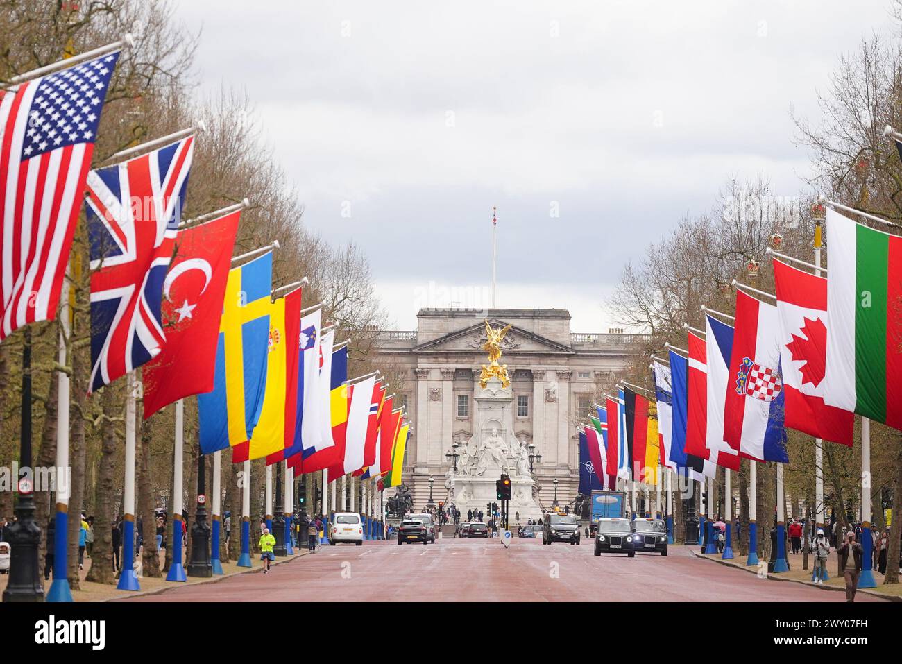The national flags of Nato member countries hang in The Mall in London ...