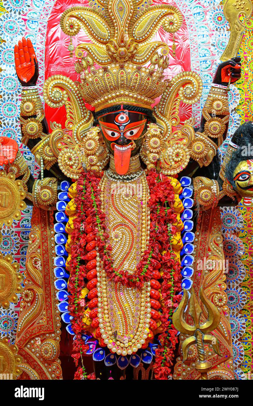Idol of Goddess Maa Kali at a decorated puja pandal in Kolkata, West Bengal, India. Kali puja ...