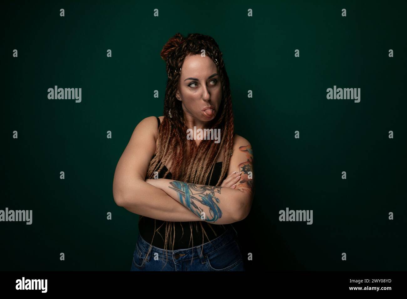 Woman Making Funny Face With Arms Crossed Stock Photo - Alamy