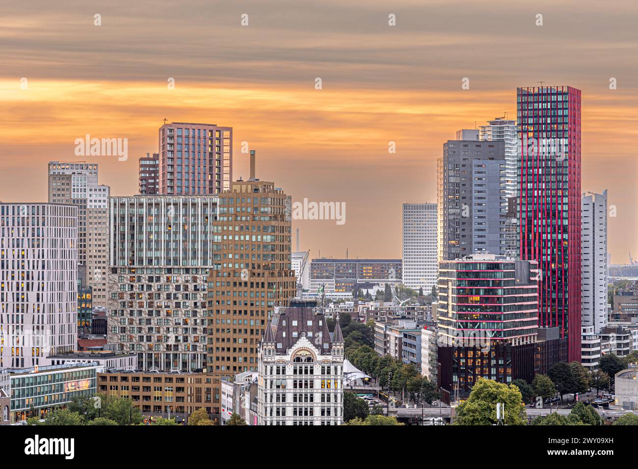 Sky line of Rotterdam, Netherlands at sunset showing the sky scrapers ...