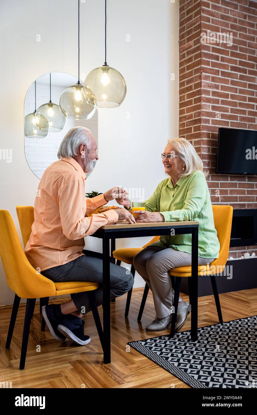 Happy man eating breakfast home hi-res stock photography and images - Alamy