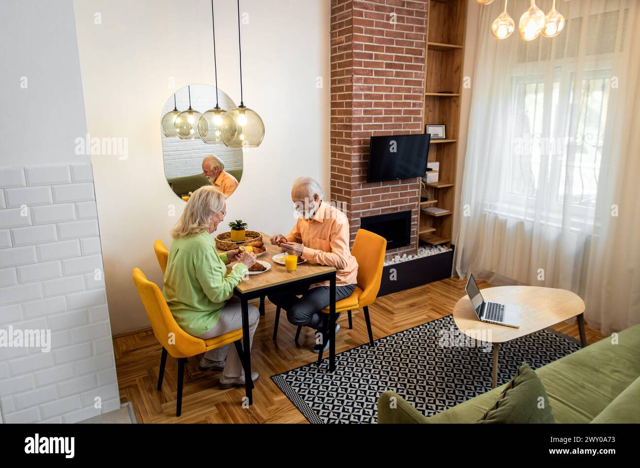 Senior caucasian man eating breakfast hi-res stock photography and ...