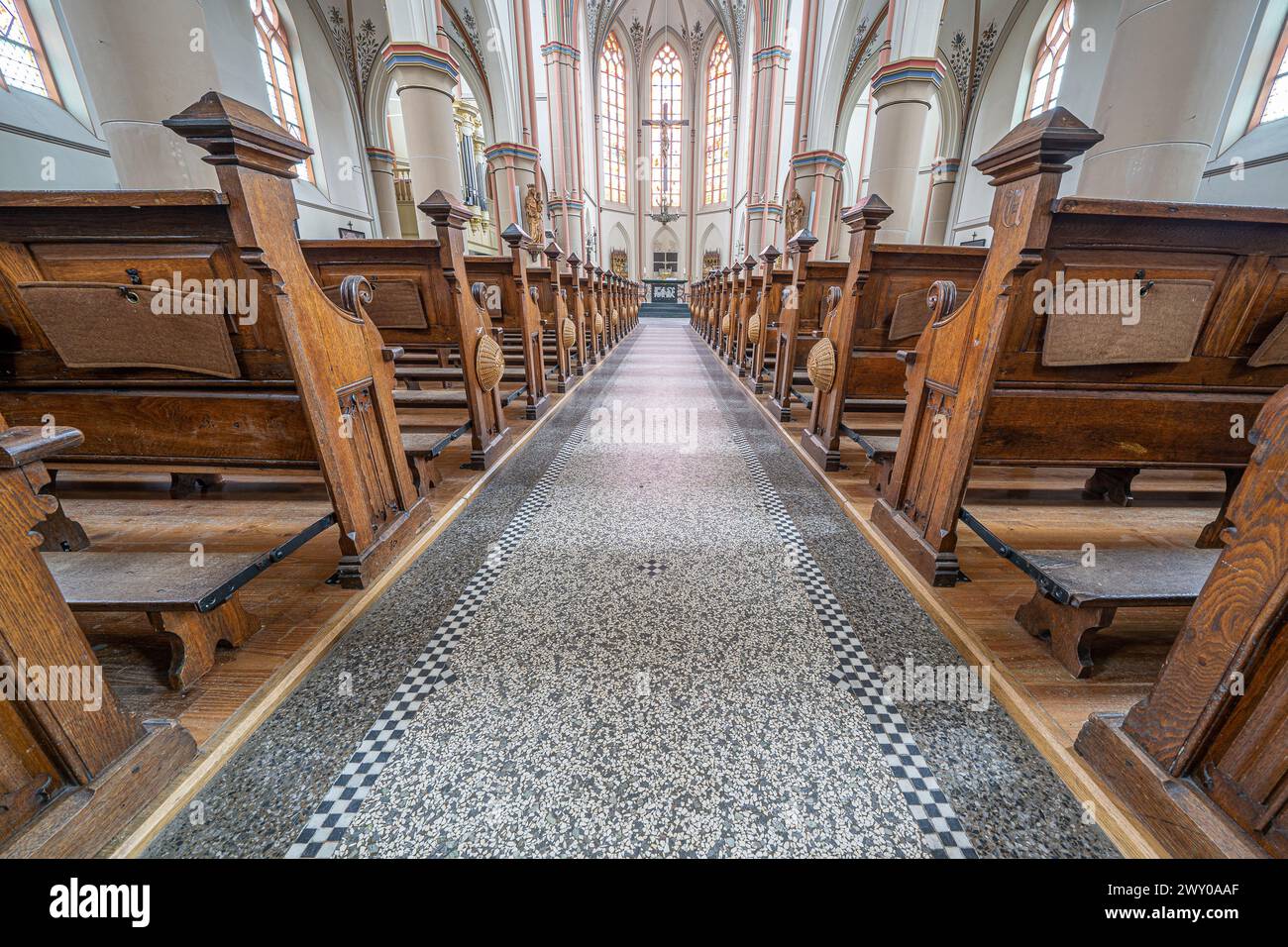 Interior of an old church with wooden benches and an impressively ...