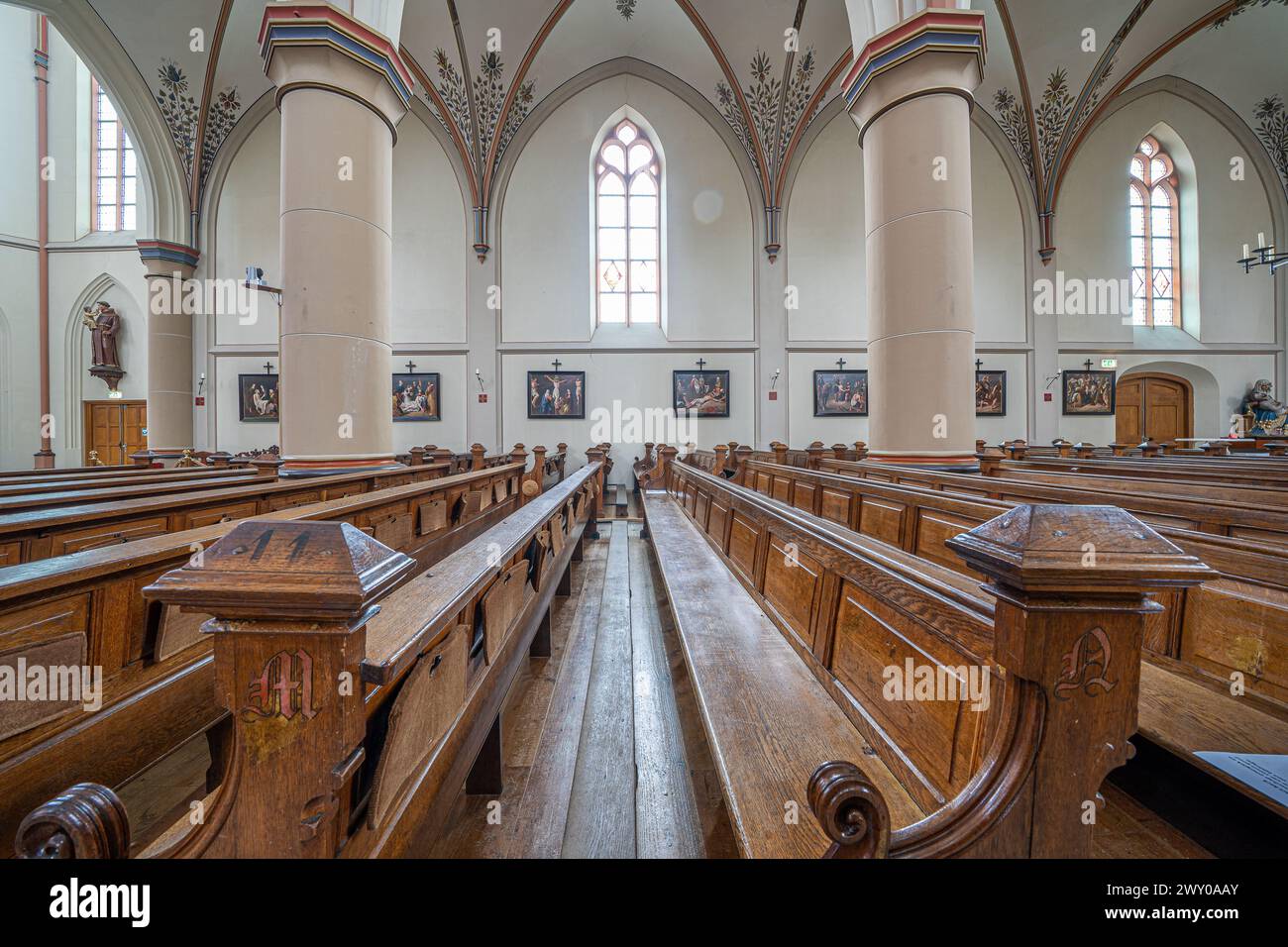 Interior of an old church with wooden benches and an impressively ...