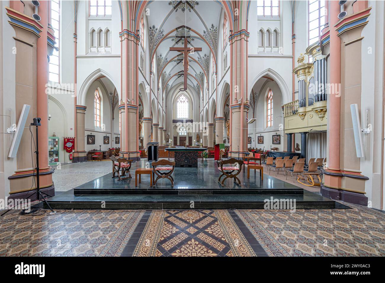Interior of an old church with wooden benches and an impressively ...