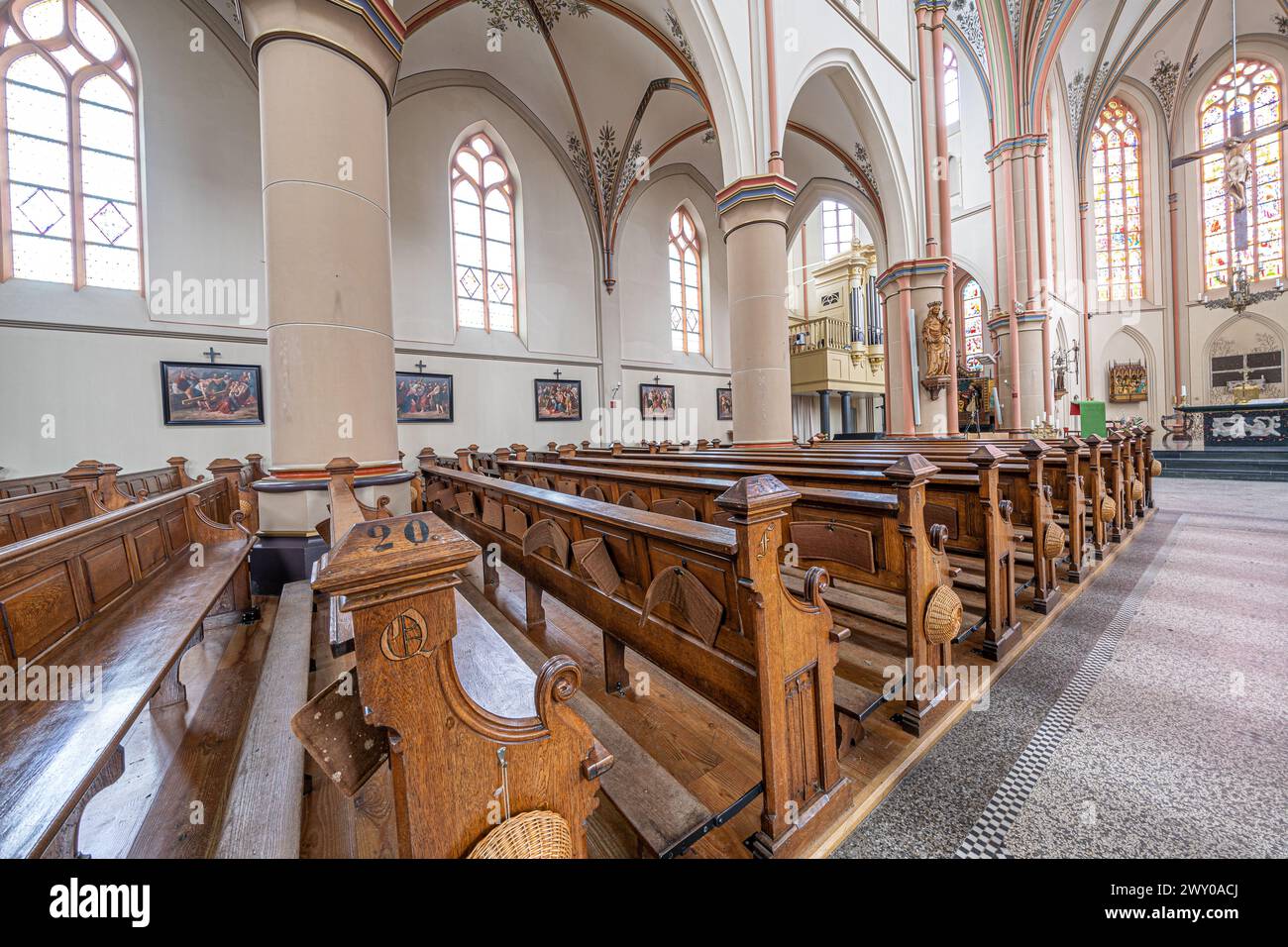 Interior of an old church with wooden benches and an impressively ...