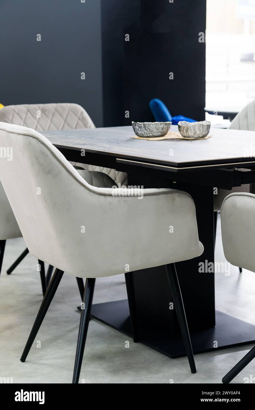 Gray wooden folding table combined with gray chairs with soft fabric ...