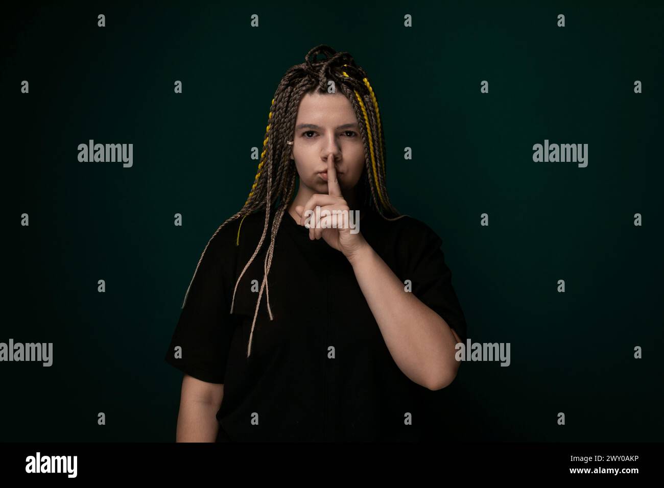 Serious woman making shush gesture hi-res stock photography and images ...