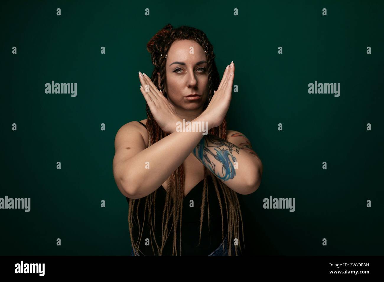 Woman With Dreadlocks Covering Her Face Stock Photo - Alamy