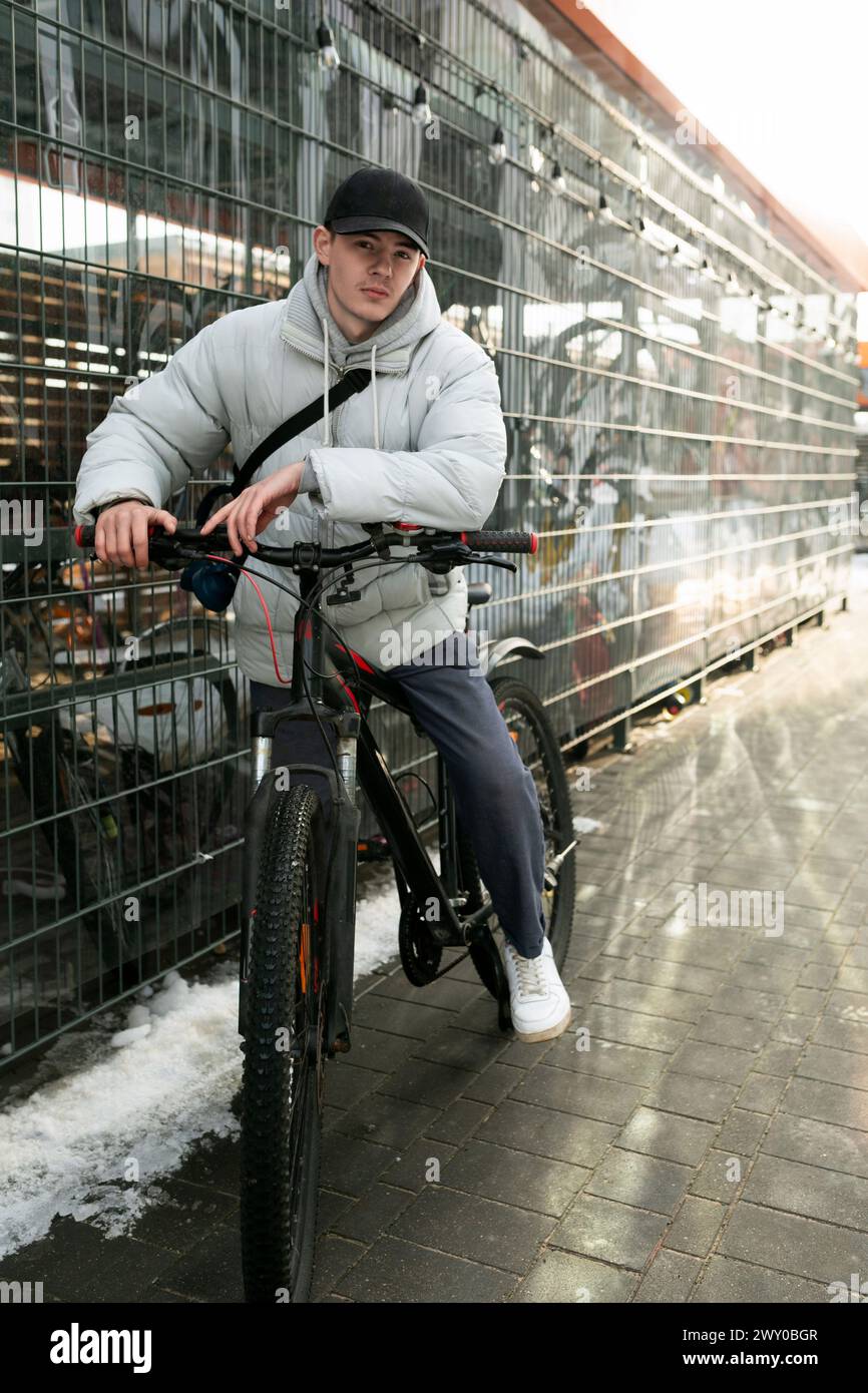 European man takes a bike ride through the city Stock Photo - Alamy