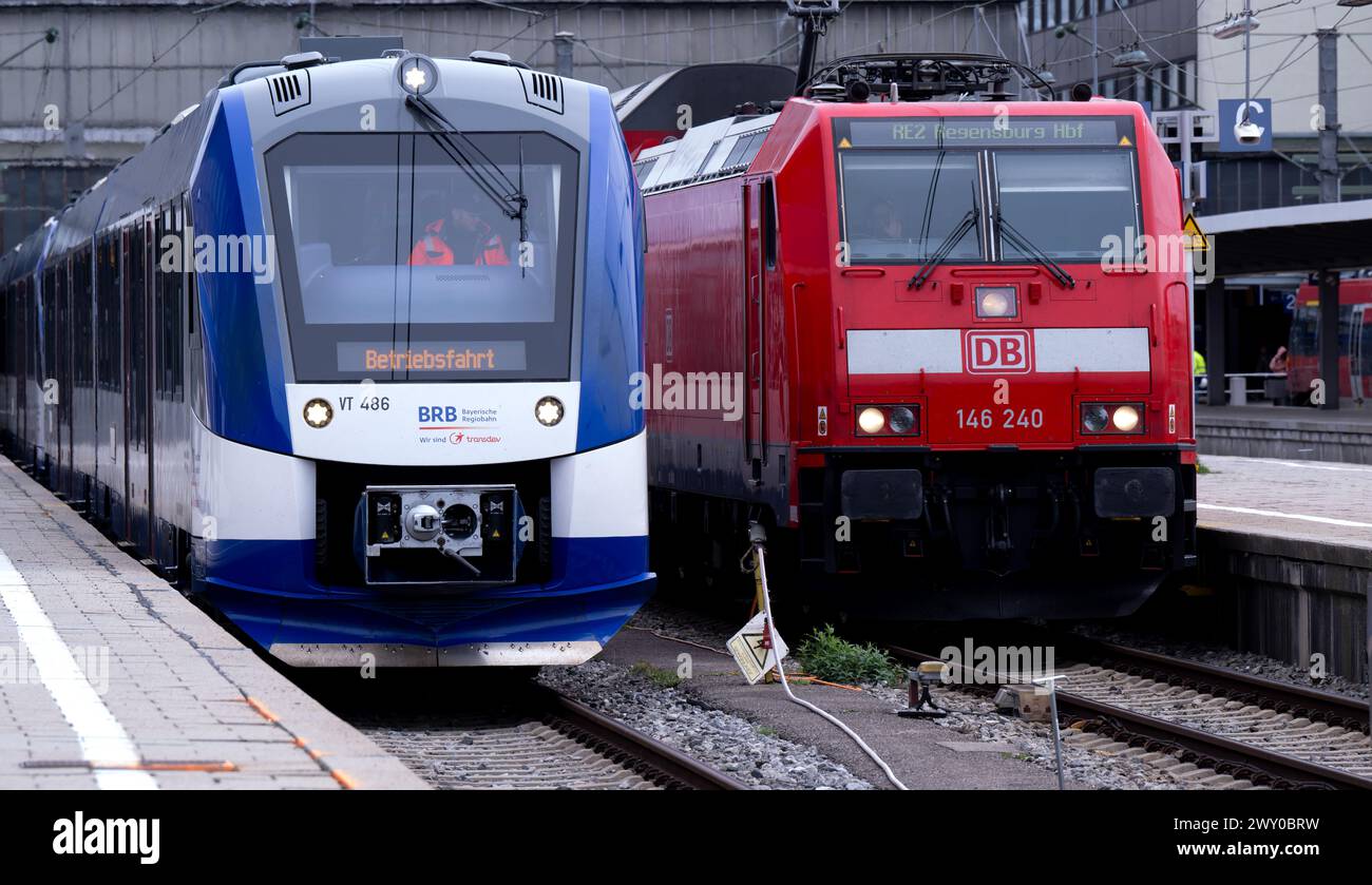 Munich, Germany. 03rd Apr, 2024. A Bavarian Regiobahn (l, BRB) train ...