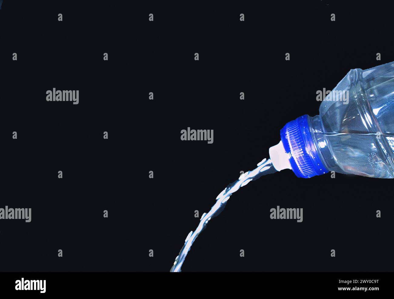 Water Pouring Out of Plastic Bottle on a black background Stock Photo ...