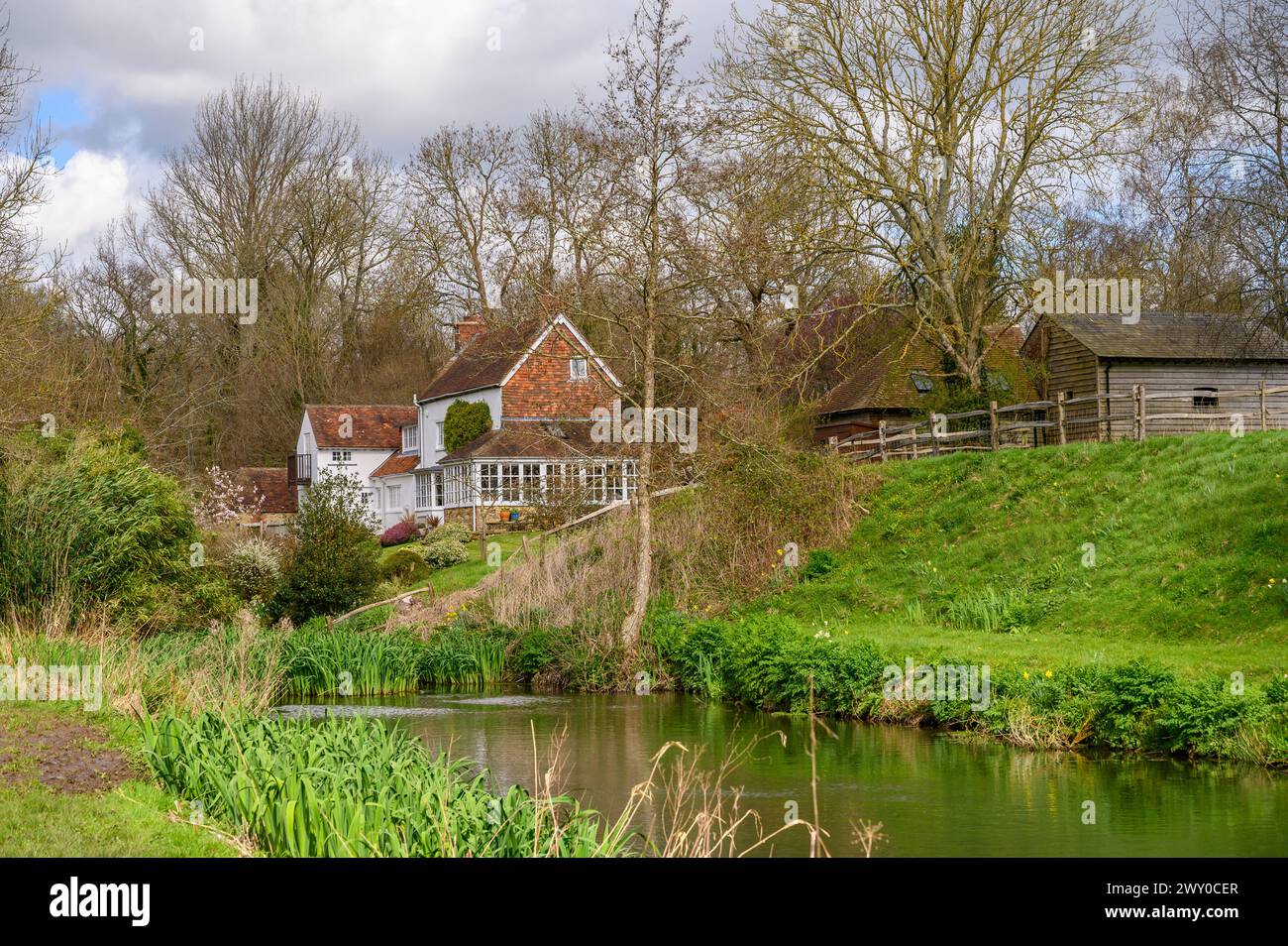The Mill House in a picturesque setting next to a stream and pond in ...