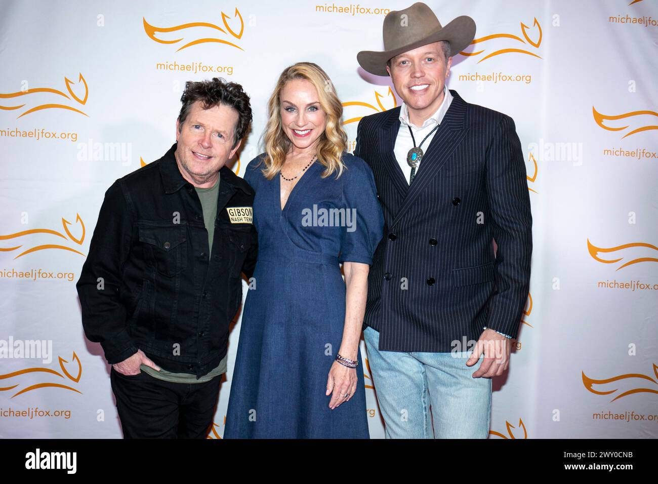 Tracy Pollan, Michael J. Fox, and Jason Isbell walk the red carpet at ...