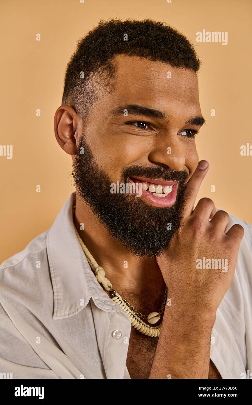 A close-up view of a stylish man with a striking beard, showcasing his unique facial hair and ...