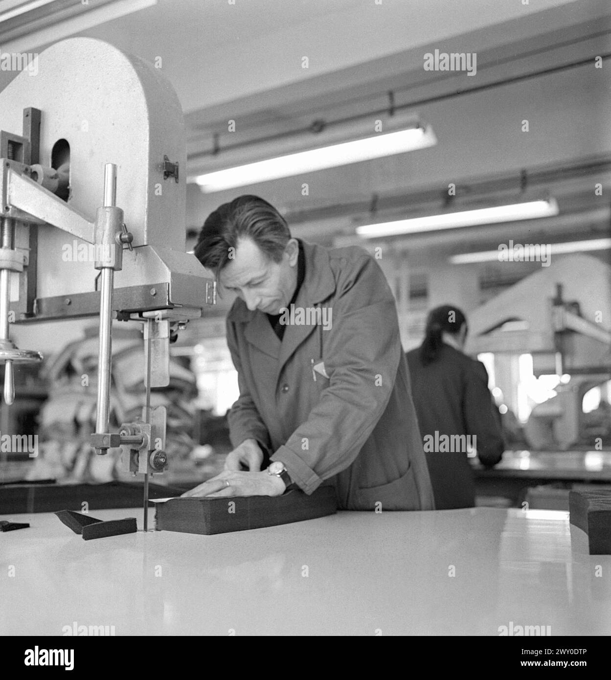 Socialist Republic of Romania in the 1970s. Worker using a fabric ...