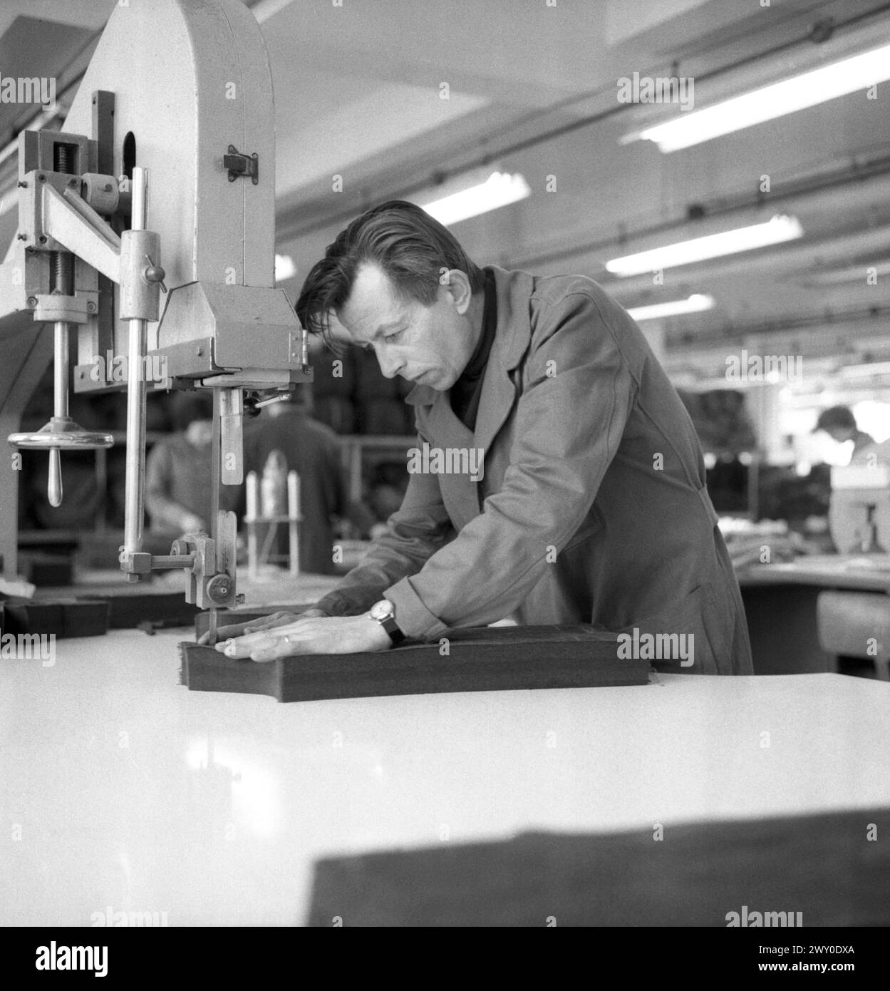 Socialist Republic of Romania in the 1970s. Worker using a fabric ...