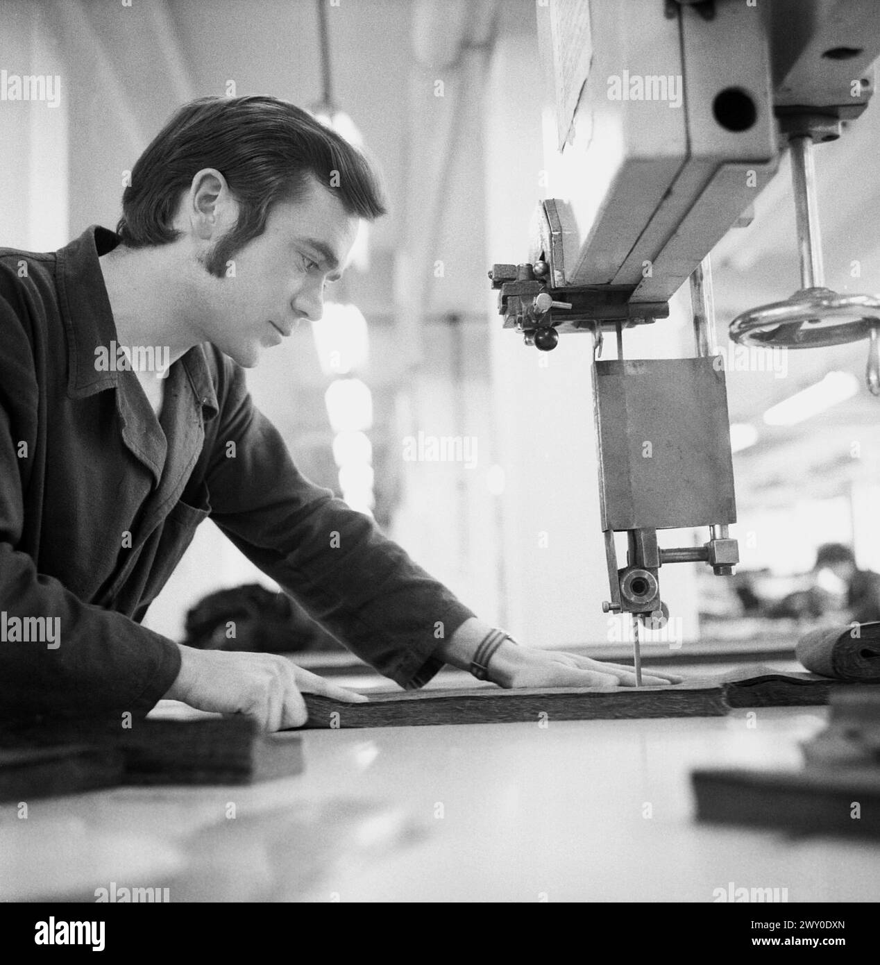 Socialist Republic of Romania in the 1970s. Worker using a fabric ...