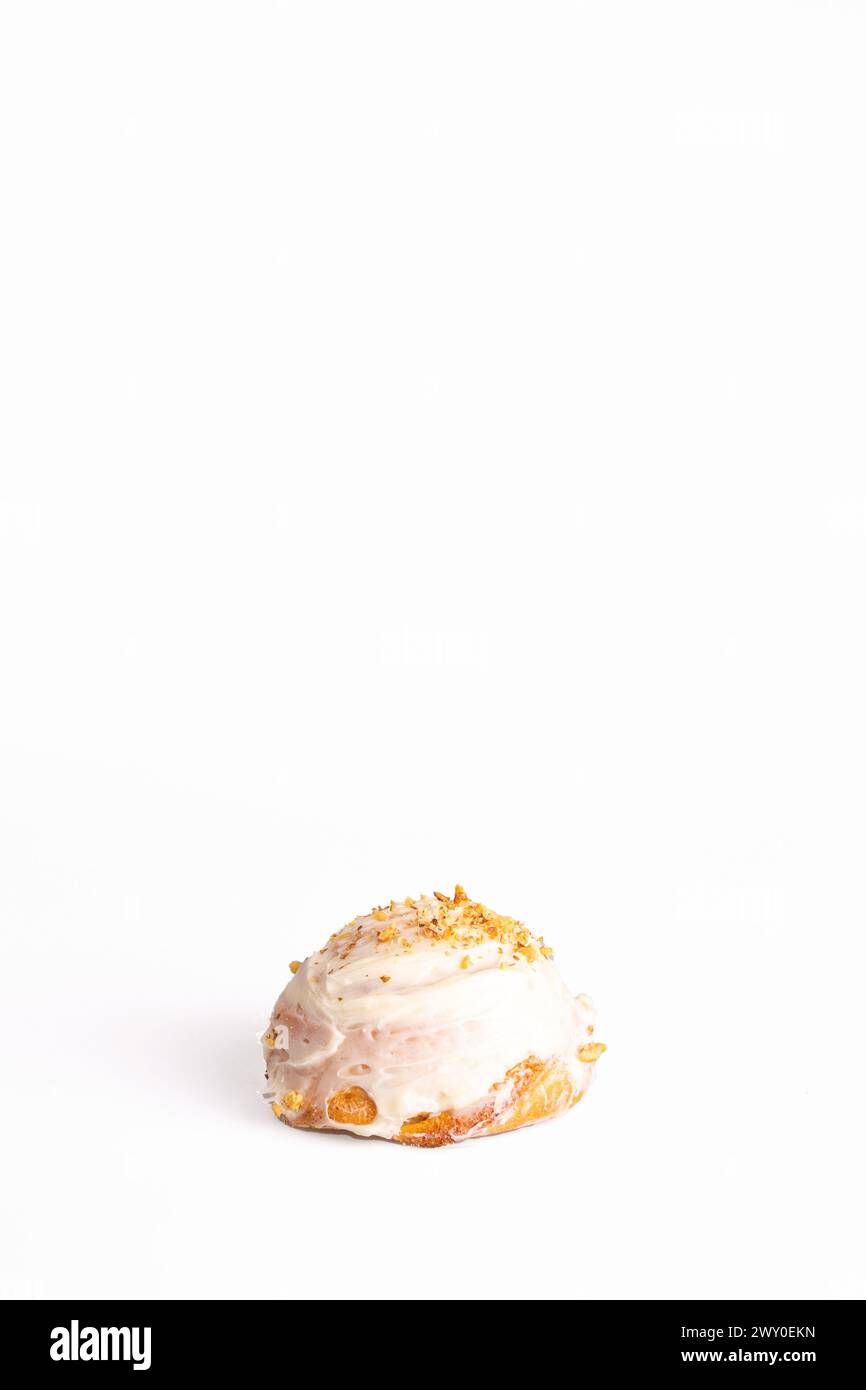 A tempting single glazed cream puff with luscious filling, elegantly ...