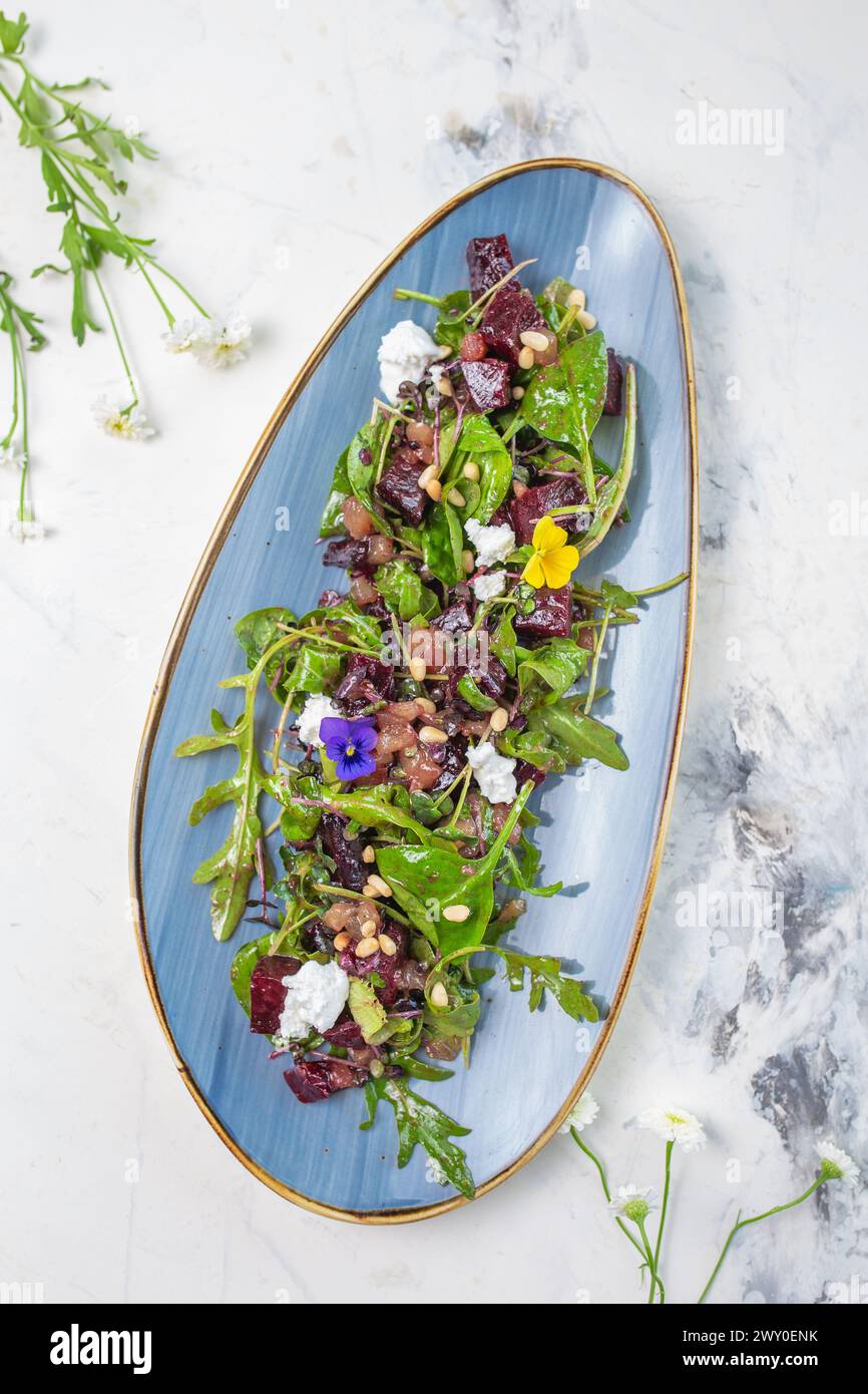 Wholesome and colorful salad of organic baby greens, roasted beets ...