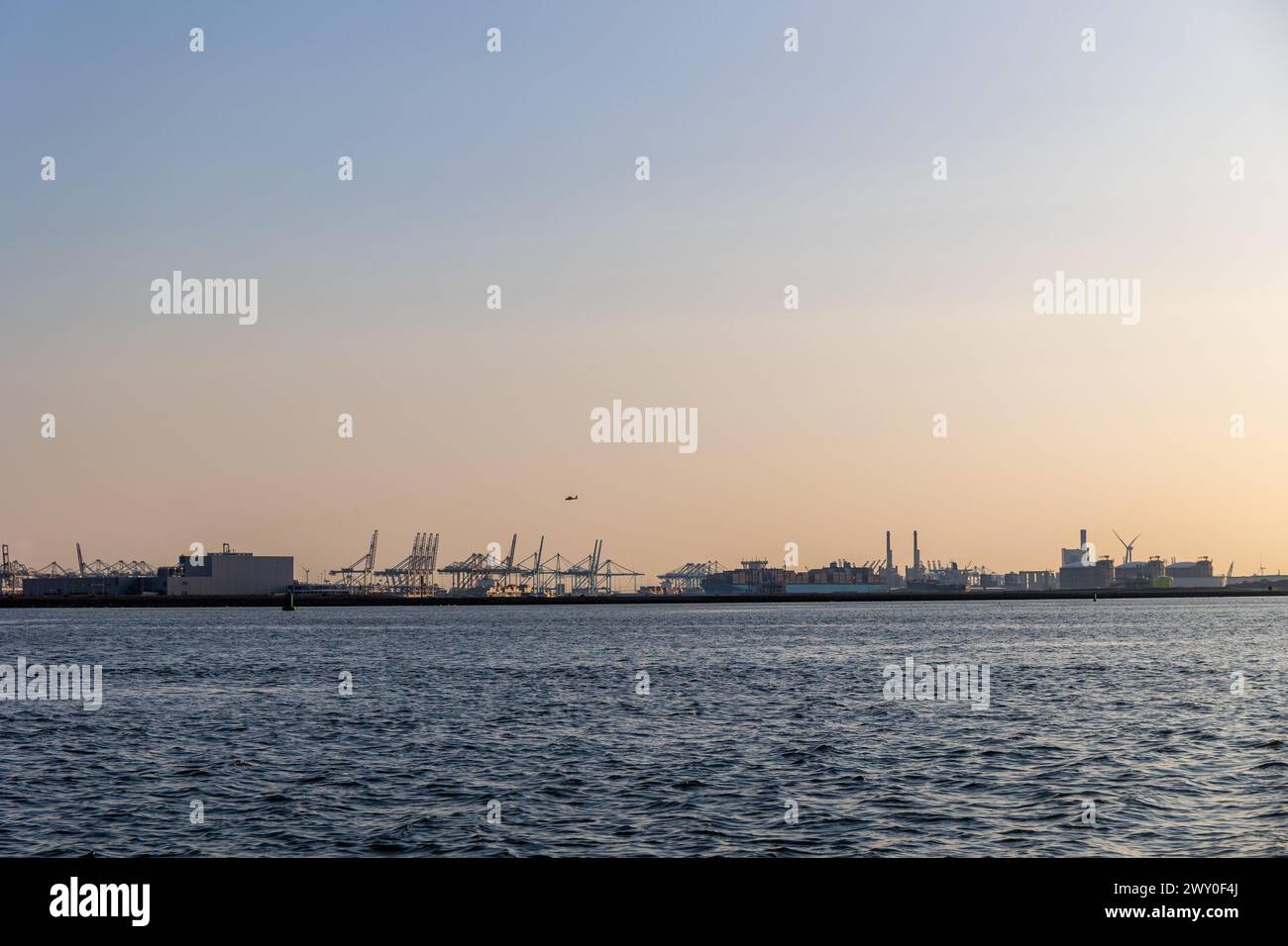Ships float across the North Sea. Windmills in the background. Sea port ...