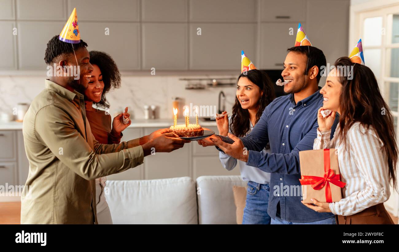 Woman presenting birthday cake hi-res stock photography and images - Alamy