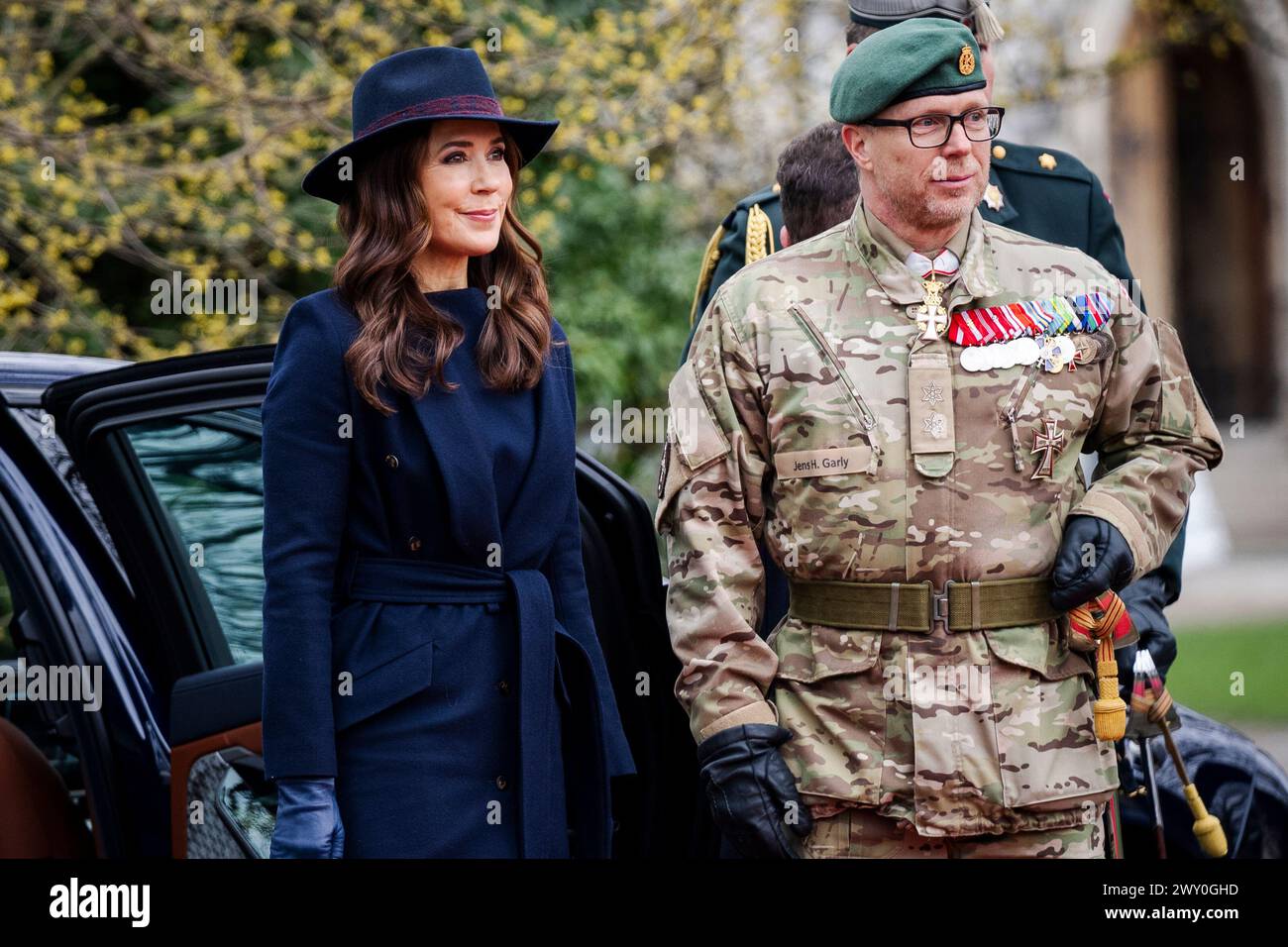 Queen Mary is received by Major General Jens Henning Garly, head of the ...