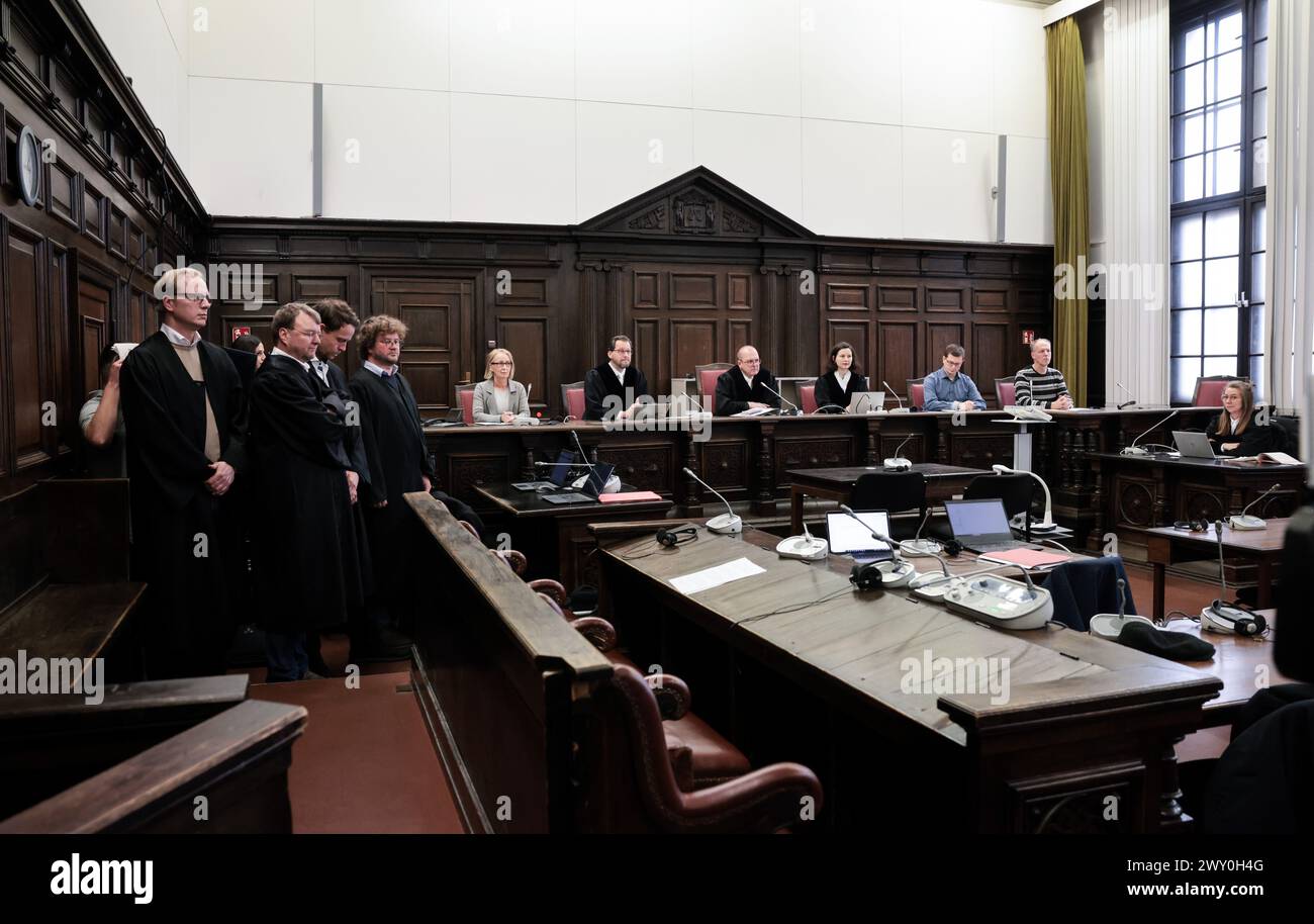 03 April 2024, Hamburg: The defendants, covered by their lawyers ...