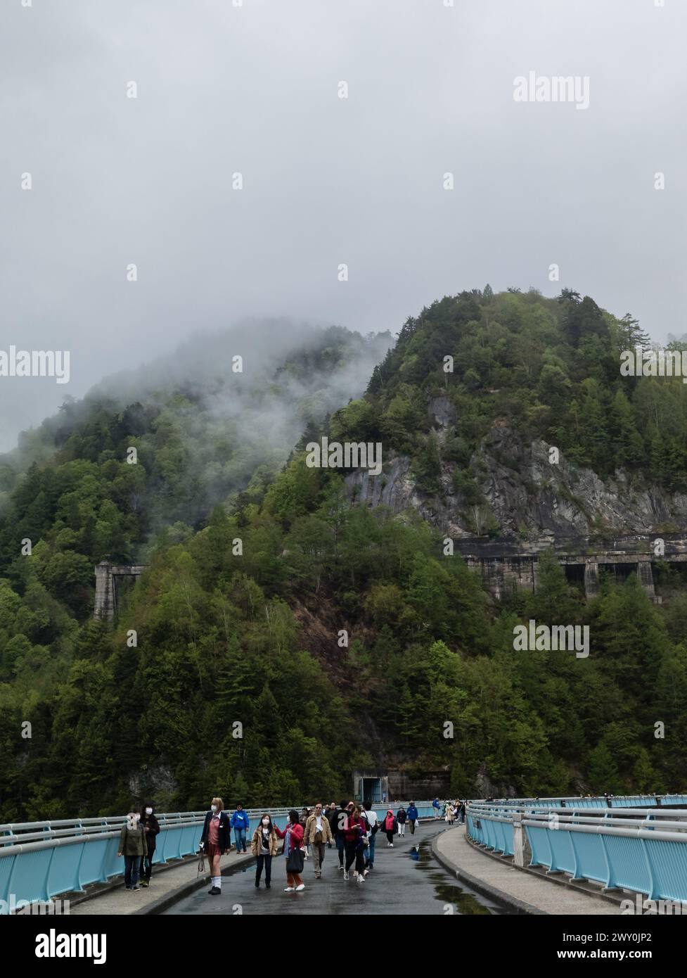 KUROBE DAM, JAPAN - MAY 26 2023: Tourists braving stormy skies and rain ...
