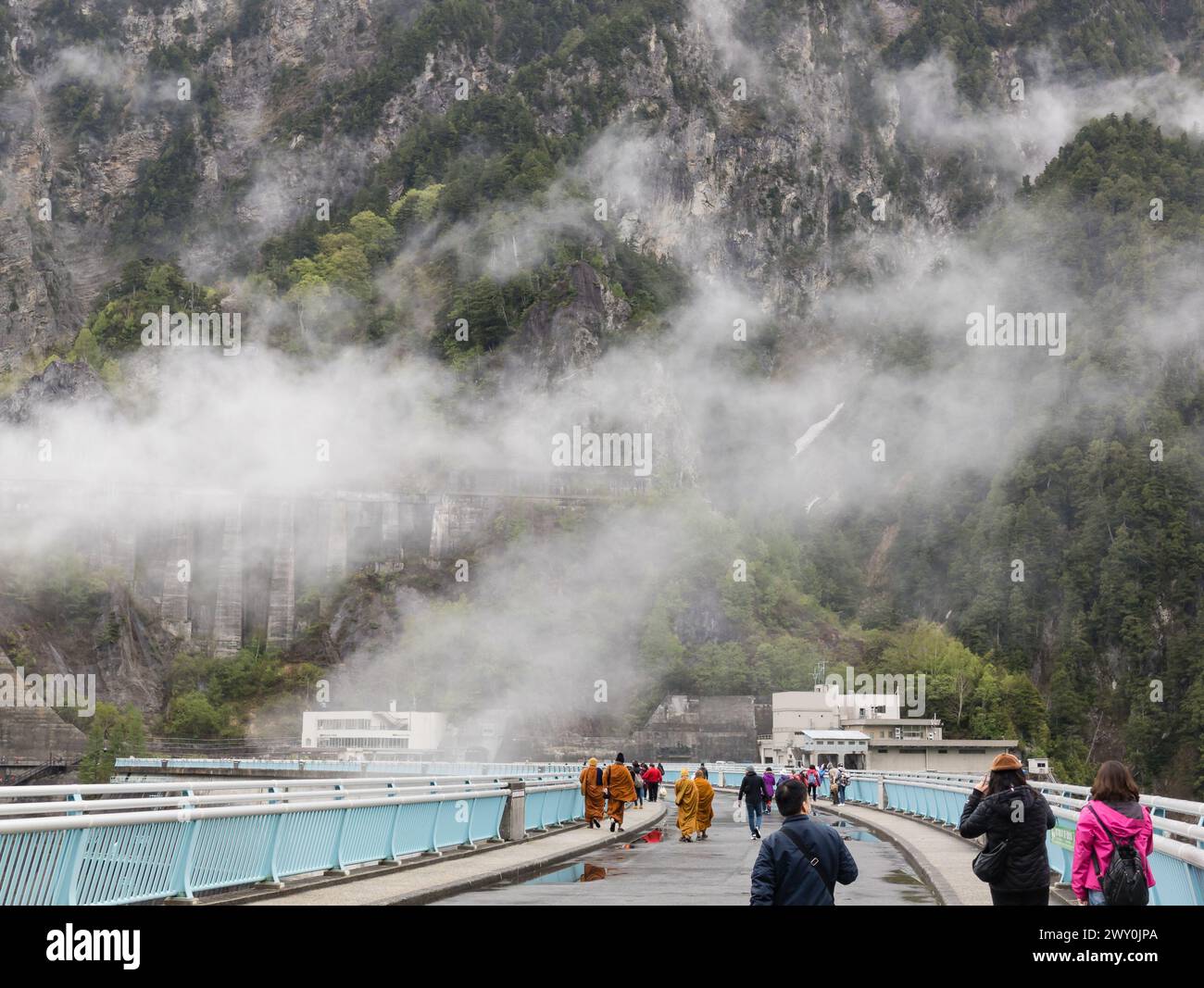 KUROBE DAM, JAPAN - MAY 26 2023: Tourists braving stormy skies and rain ...