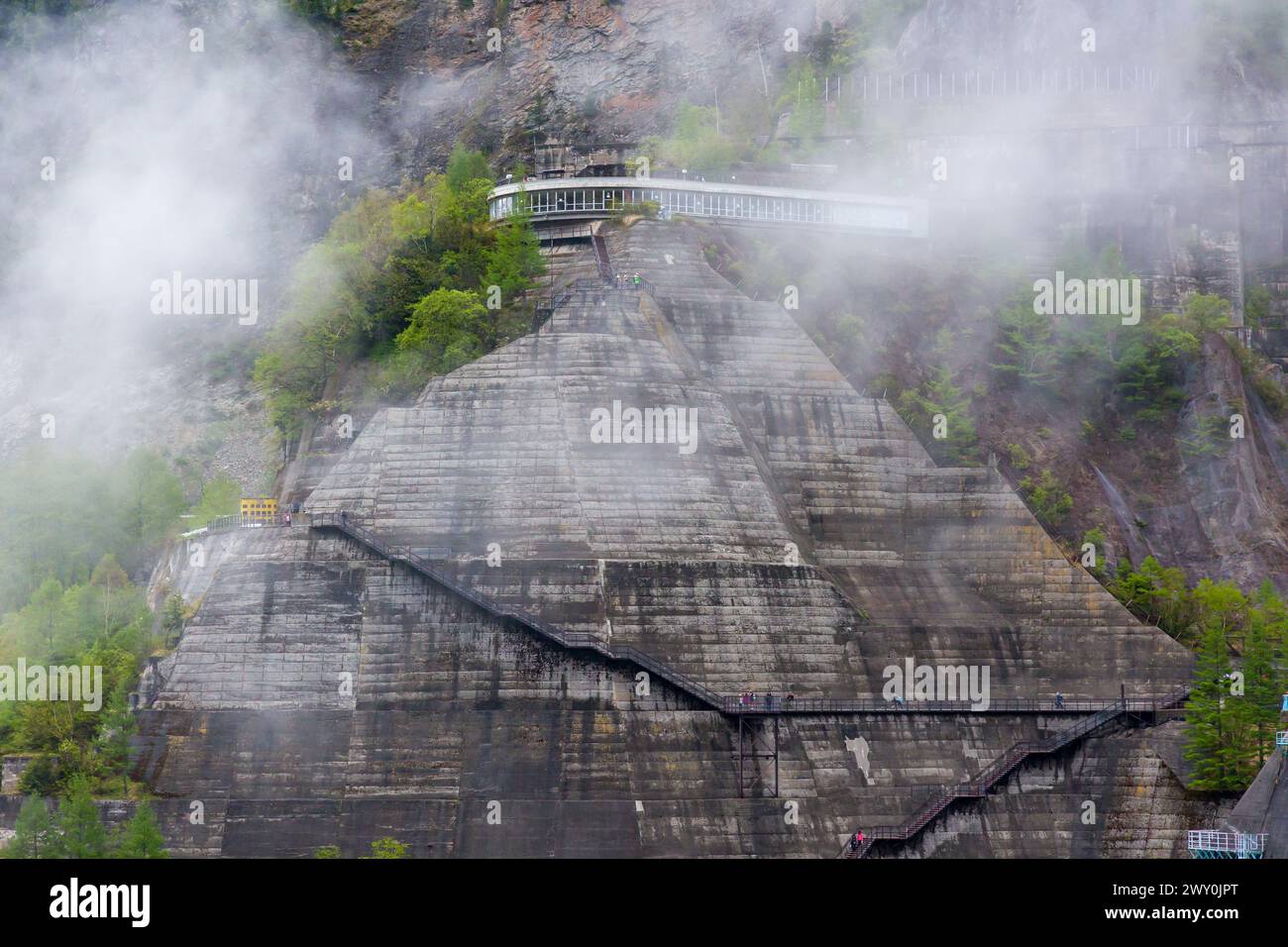 Metal steps leading vertically up the wall of a huge hydrolectric dam ...