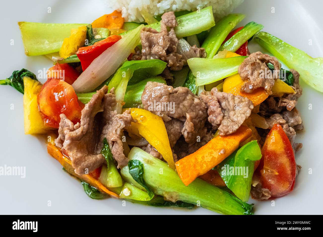 Stir frying beef with sweet peppers and bok choy. Spicy beef with ...