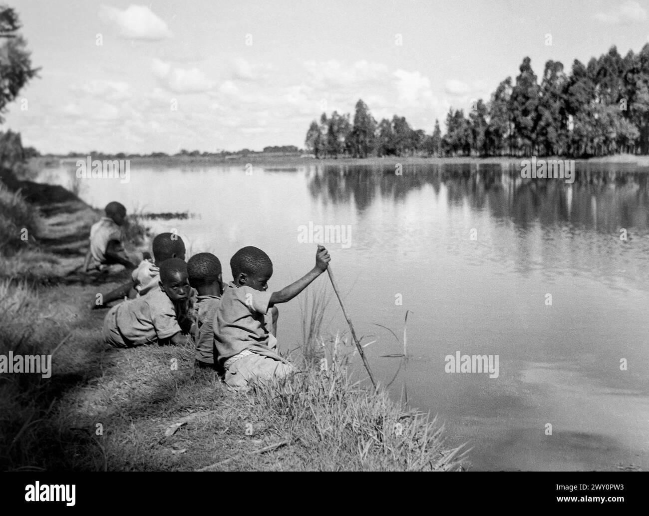 Boys sitting by a river, possibly the Kafubu, near Ndola, Northern ...