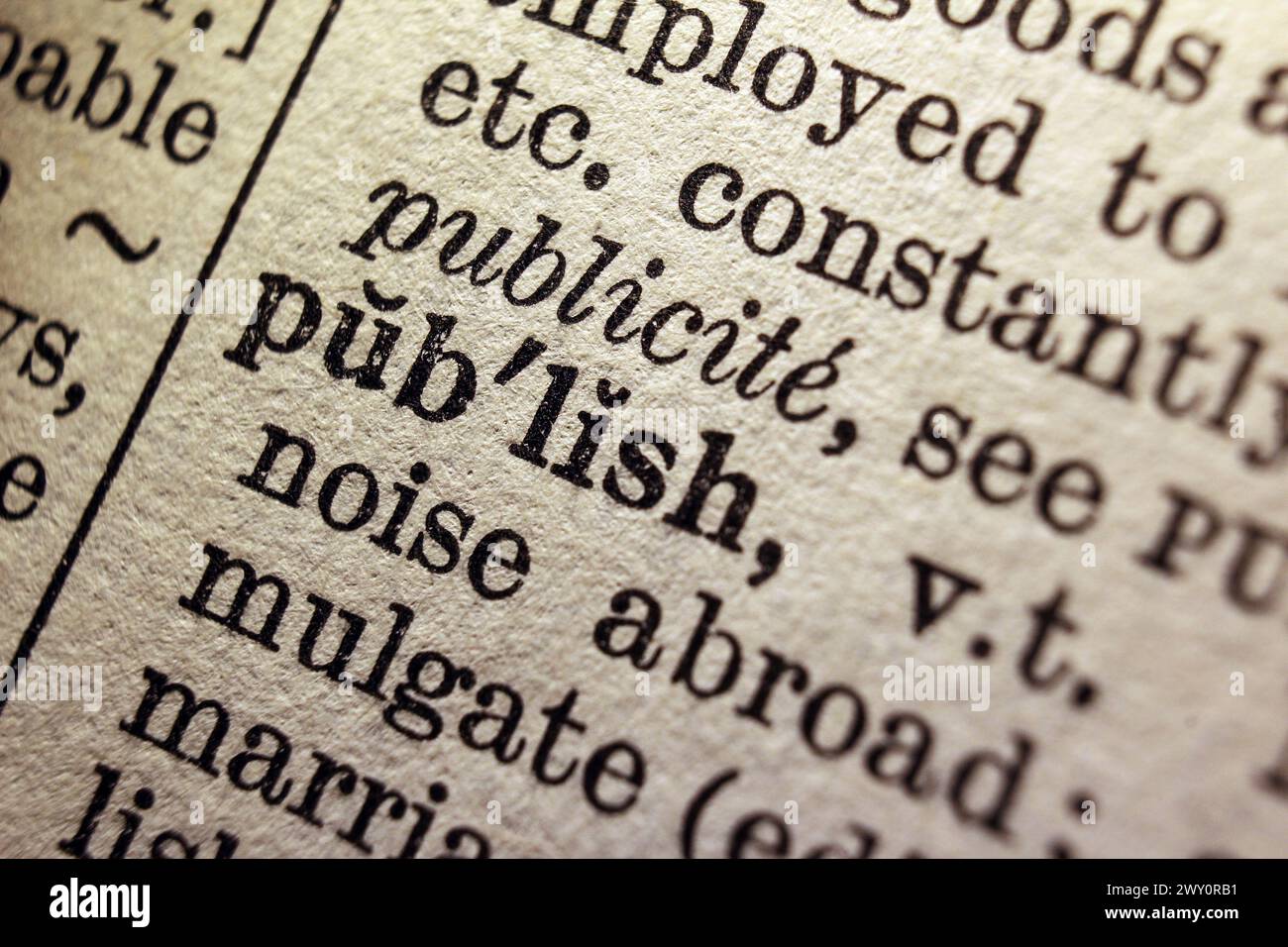 Word publish on dictionary page, macro close-up Stock Photo - Alamy