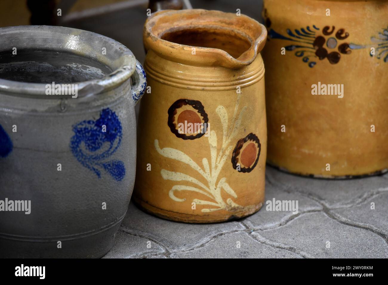 Antique Alsatian glazed pottery pitchers with old farmhouse motifs on ...
