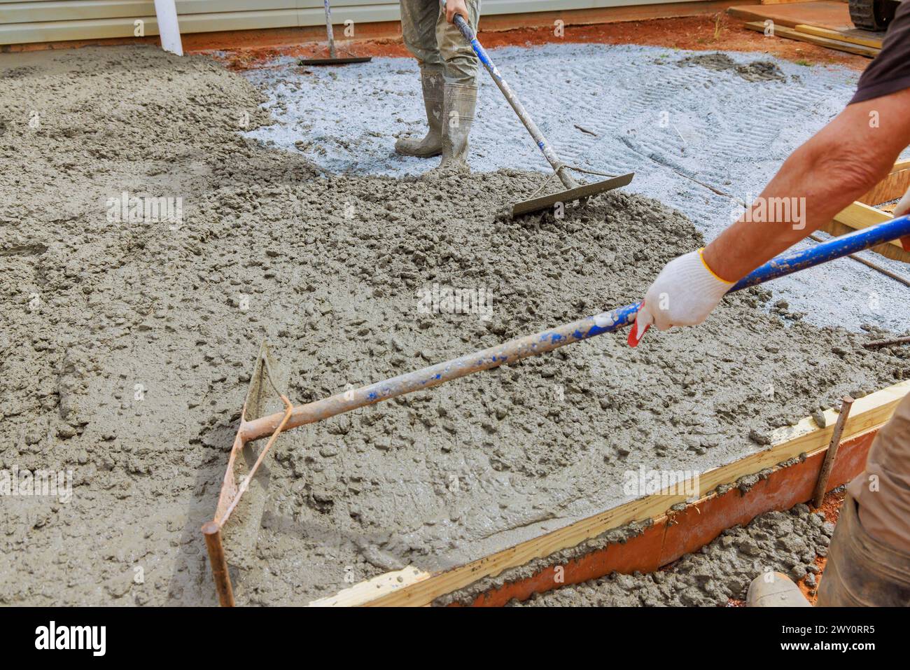 Construction worker leveling of concrete by using special tools Stock ...